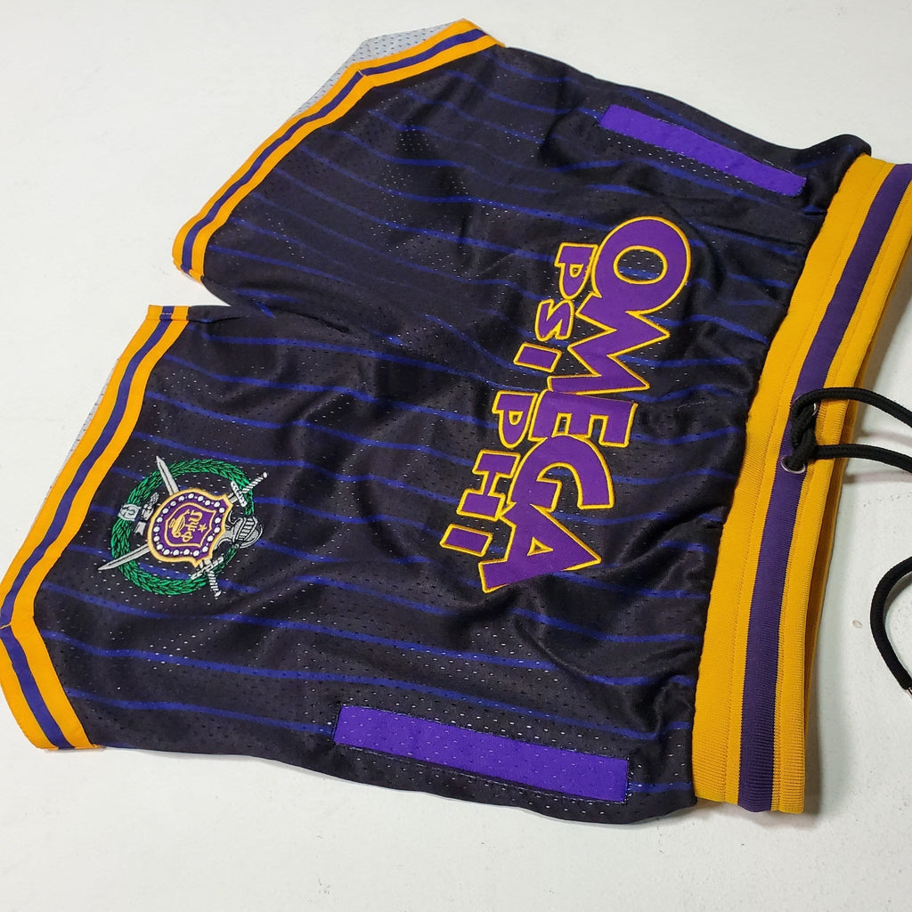 Omega Psi Phi Embroidered Black Shorts with Purple and Gold Stripes